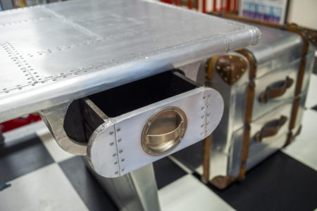 A Modern Aluminum Aircraft Desk With A Matching Cabinet
