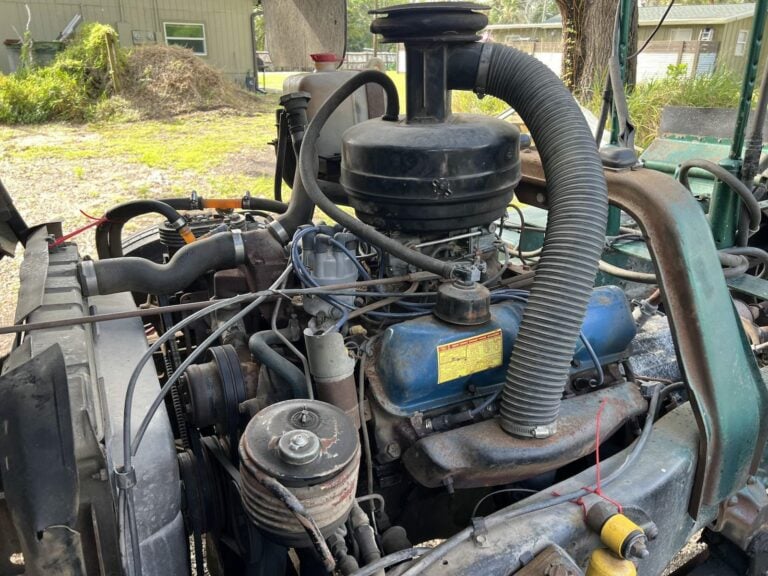 A Camelot Cruiser Motorhome With Matching Poloron Snowmobiles