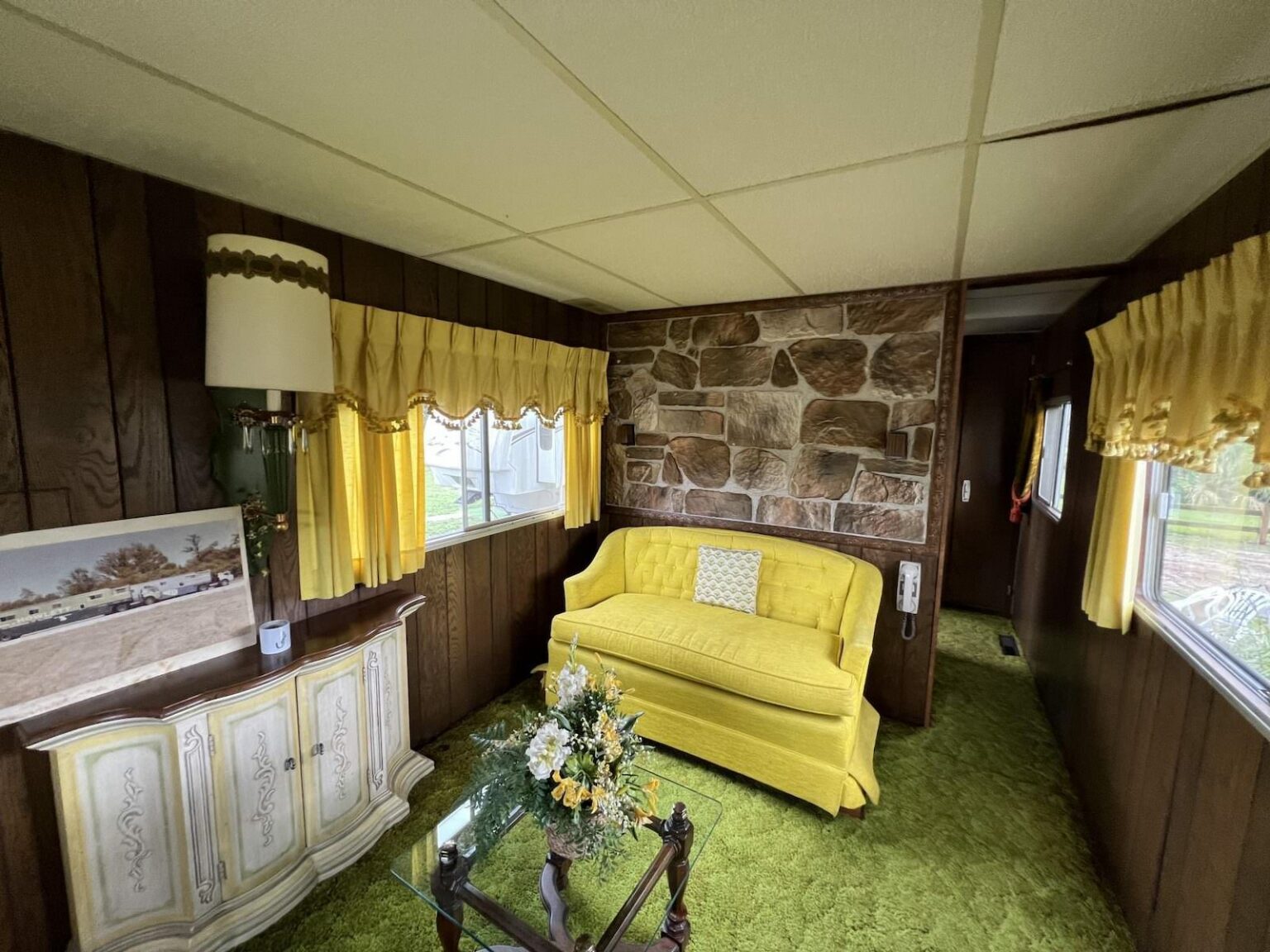 A Camelot Cruiser Motorhome With Matching Poloron Snowmobiles